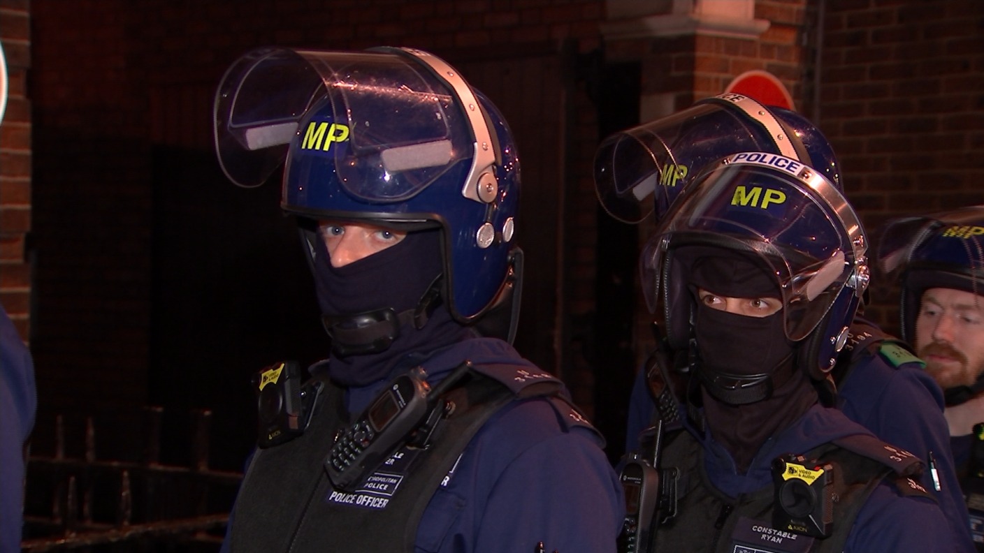 Suspects dragged from their bed as riot police storm homes looking for ...
