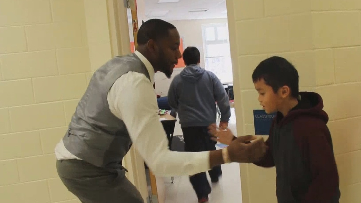 Teacher inspires school with personalised handshakes for every student ...