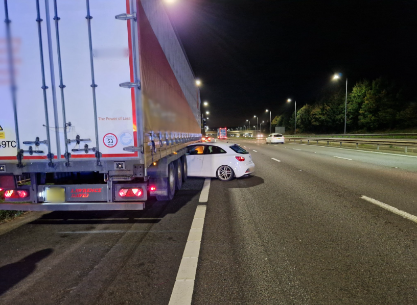 Lucky escape for driver after car becomes trapped under lorry in ...