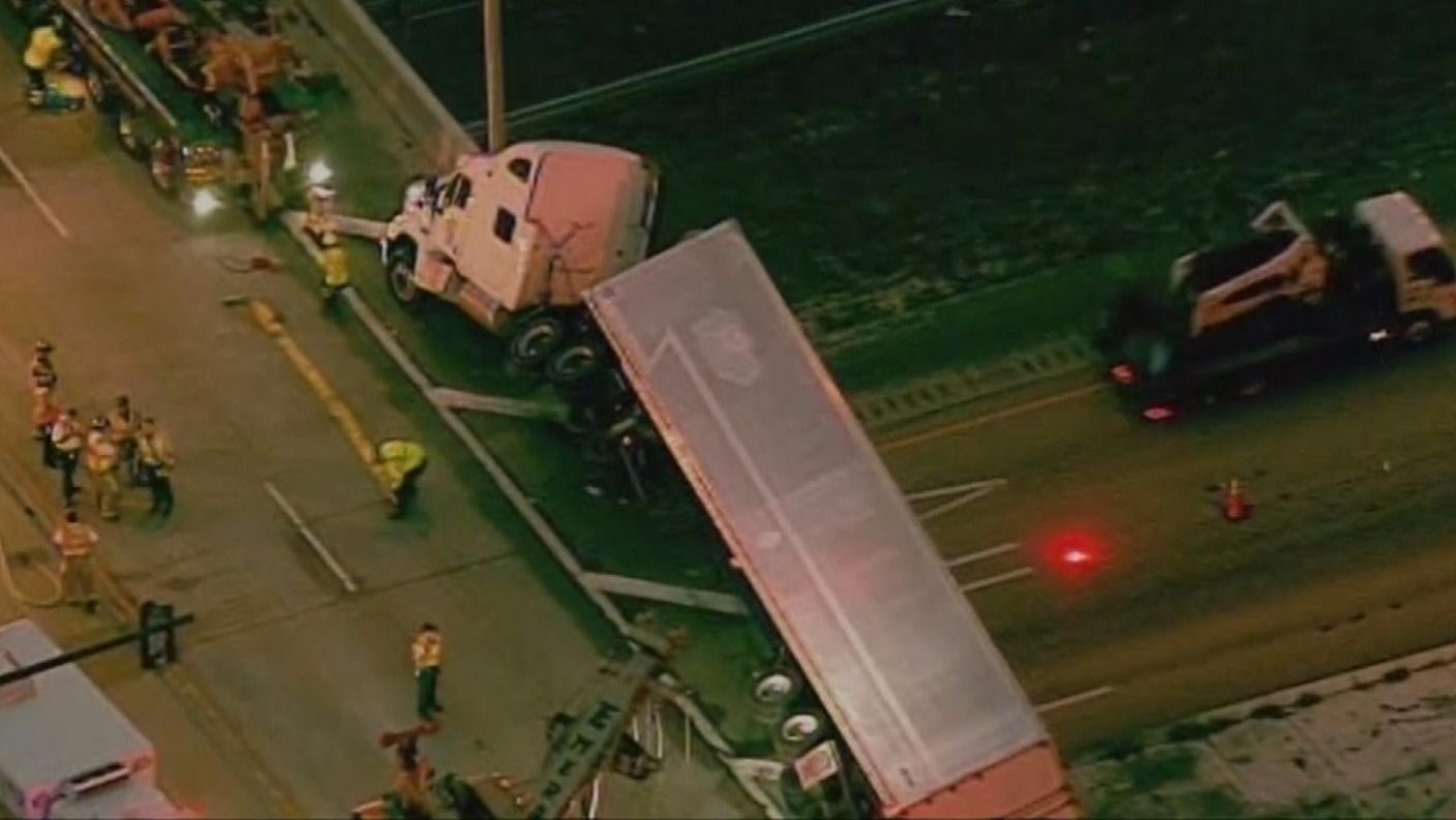 Recovery worker falls to his death after truck trailer left hanging on ...