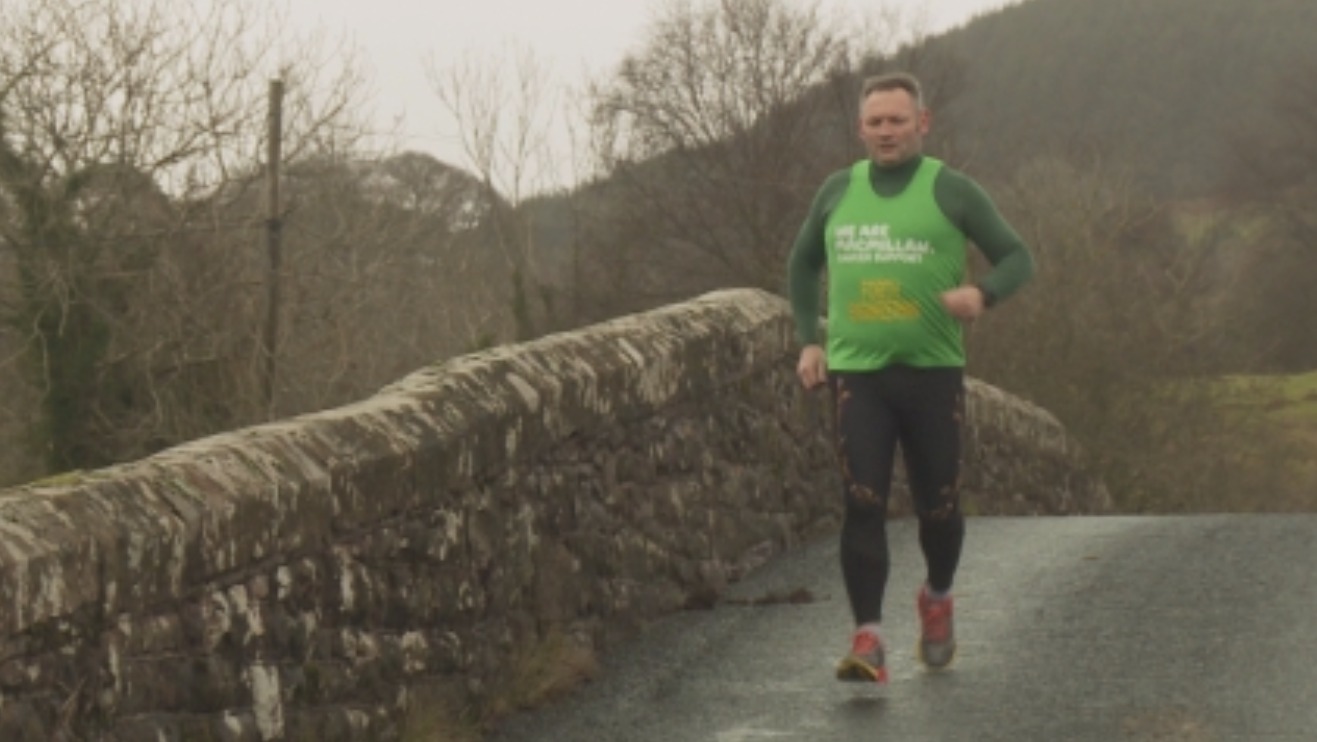 Cumbrian marathon man crosses finish line on 100th race | ITV News Border