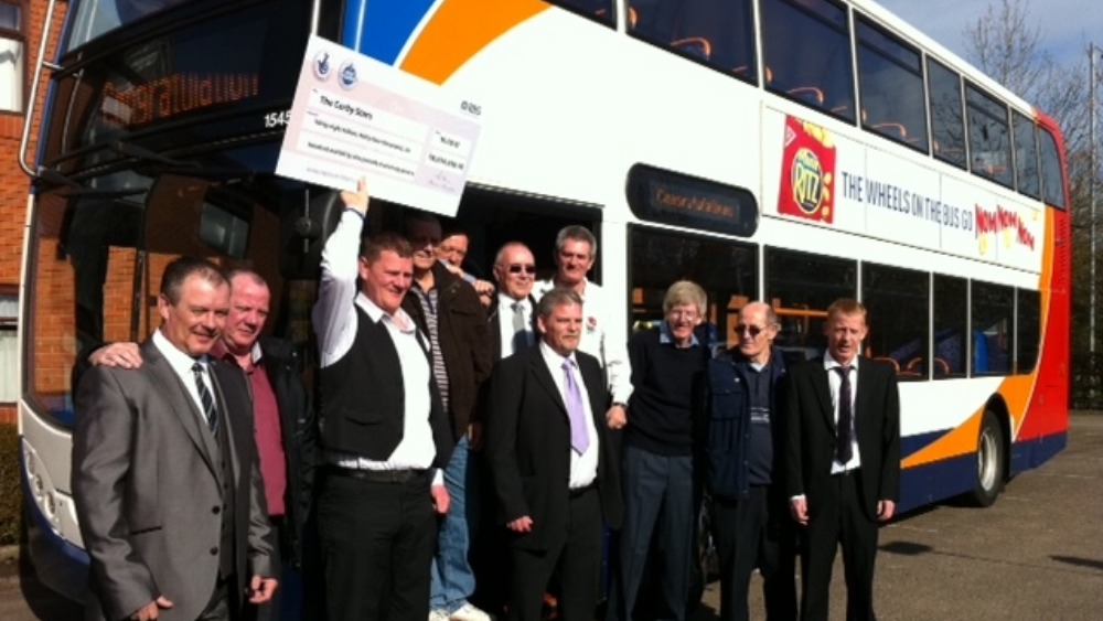 Corby bus drivers collect Euromillions win | ITV News Anglia