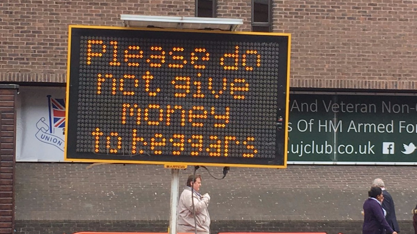 Police slammed on twitter for anti-begging sign | ITV News London