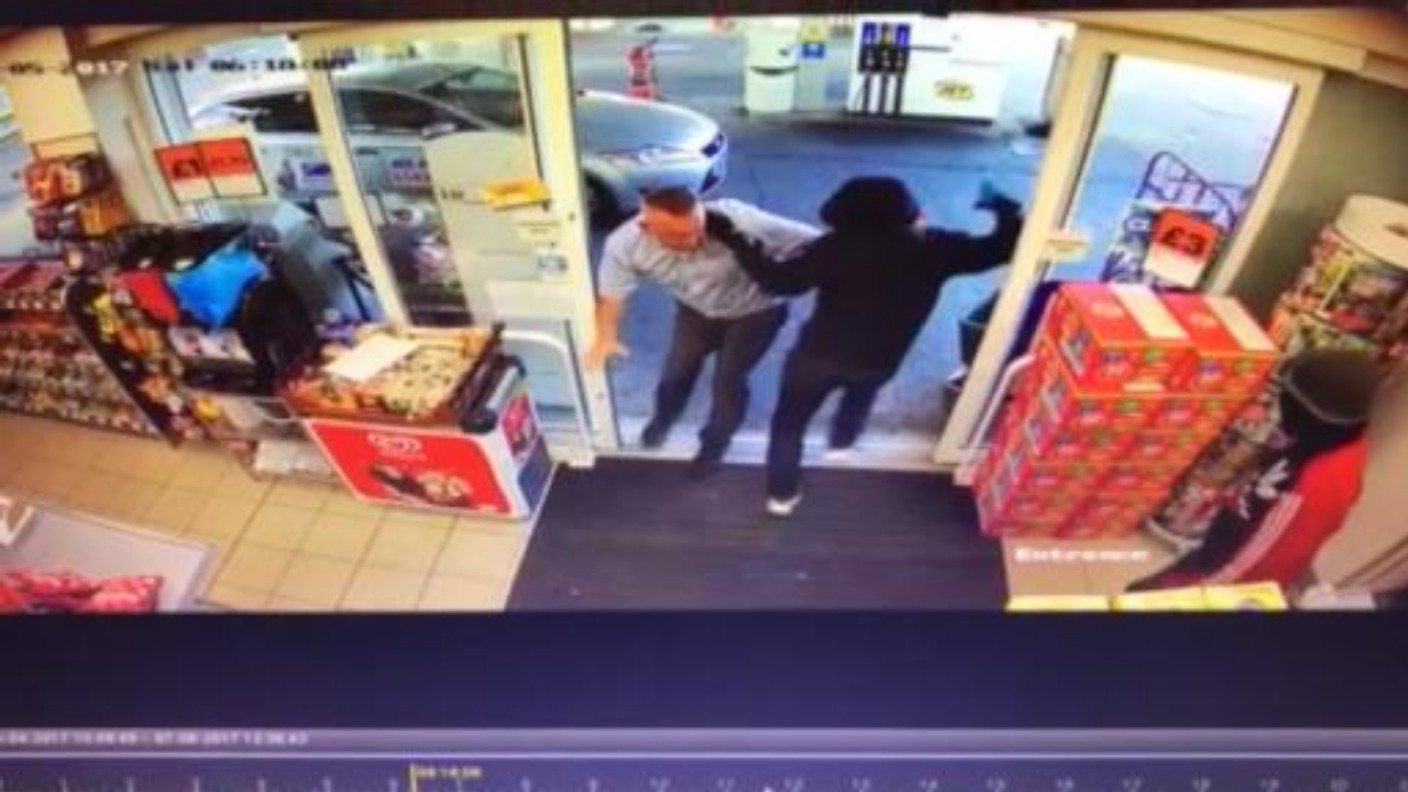 CCTV shows moment taxi driver tackles two armed robbers | ITV News Central