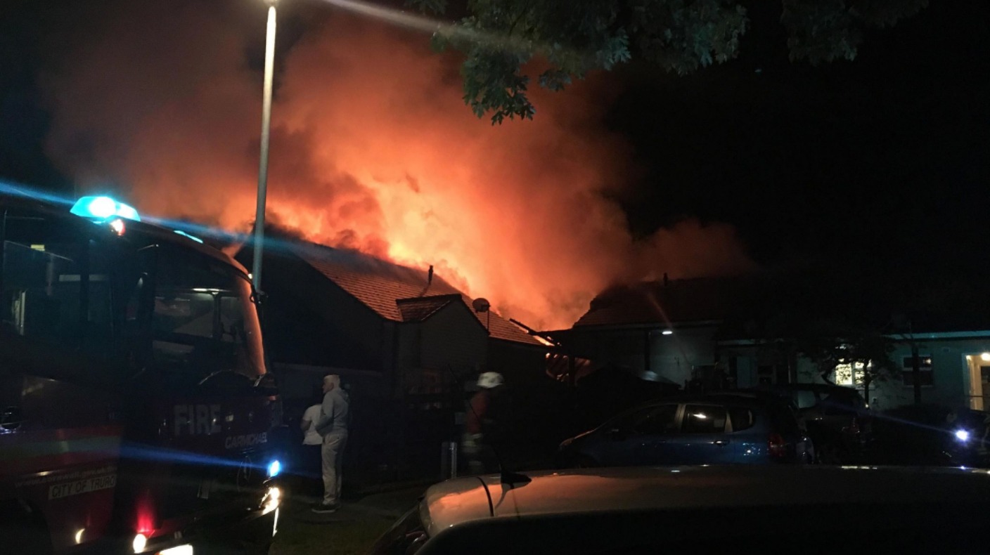 Man arrested on suspicion of arson after three homes are destroyed in ...