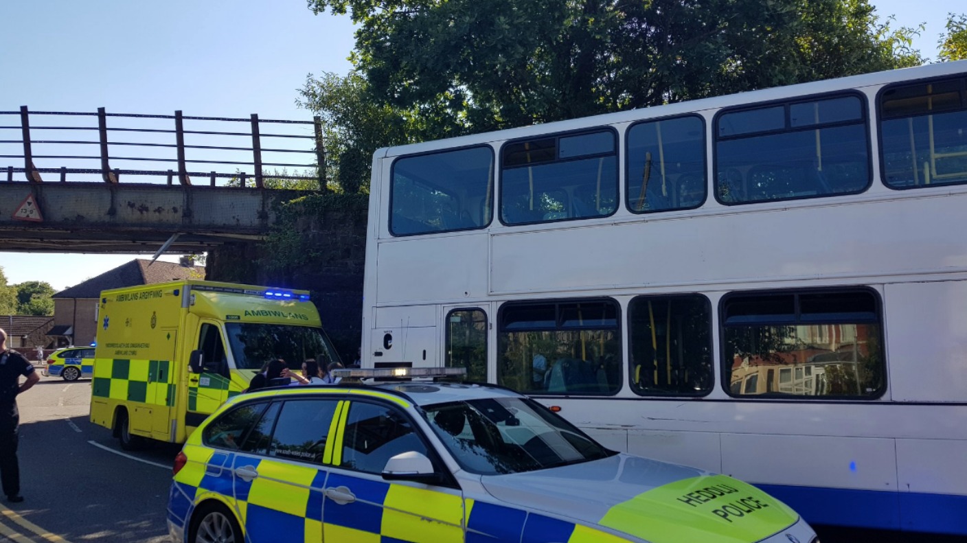 One person taken to hospital after school bus bridge crash | ITV News Wales