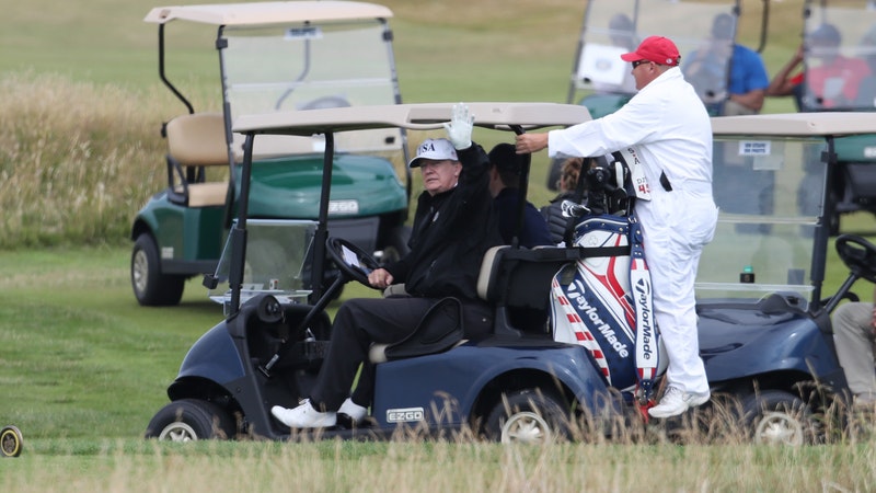 In Pictures: Trump plays golf while police and protesters surround his ...
