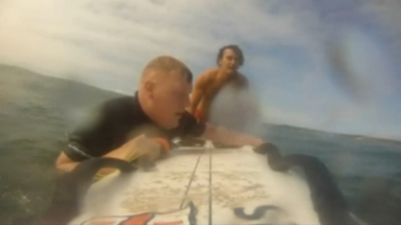 Exhausted surfer saved by RNLI | ITV News Channel