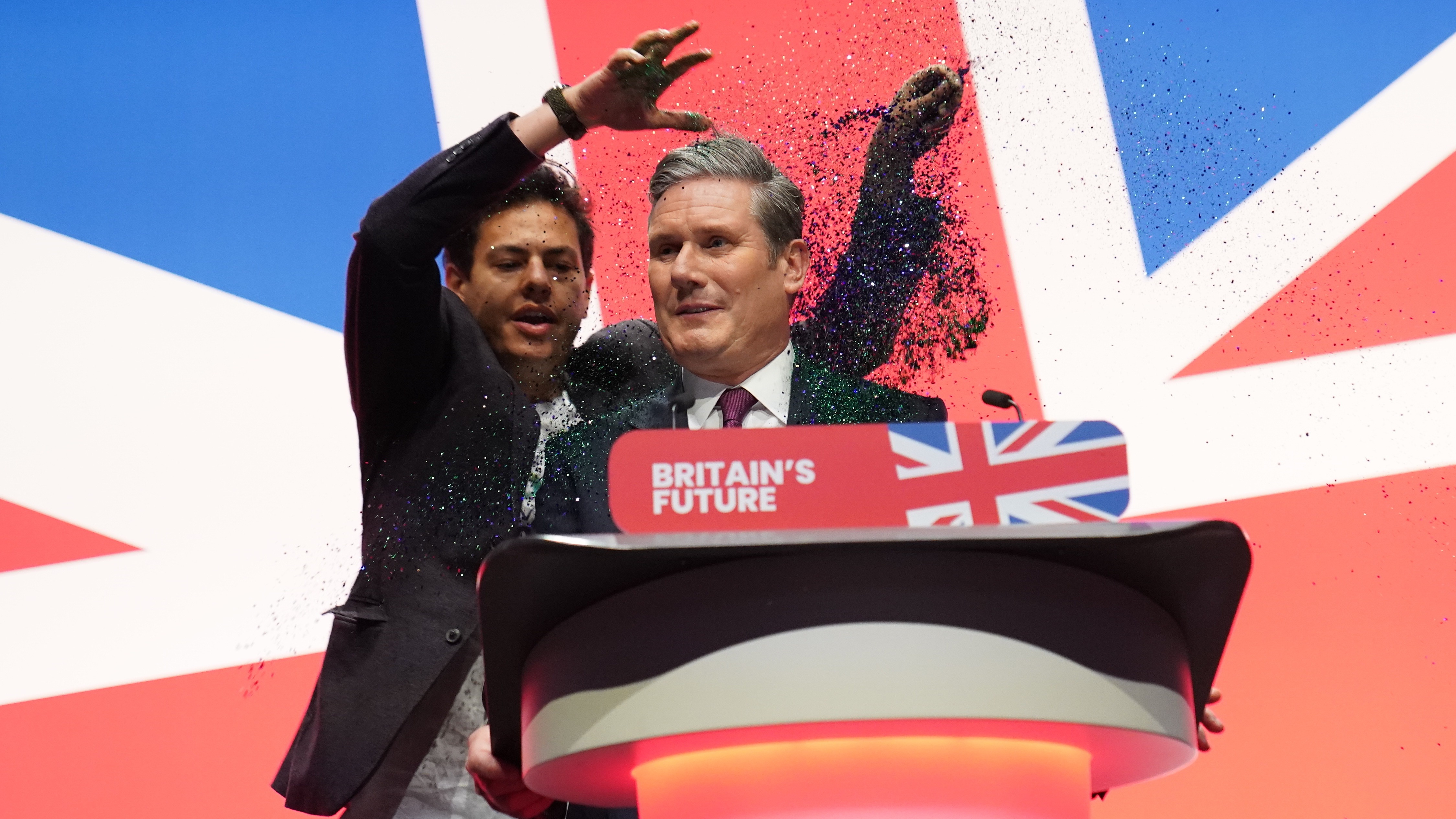 Protester covers Starmer in glitter during speech as Labour leader ...
