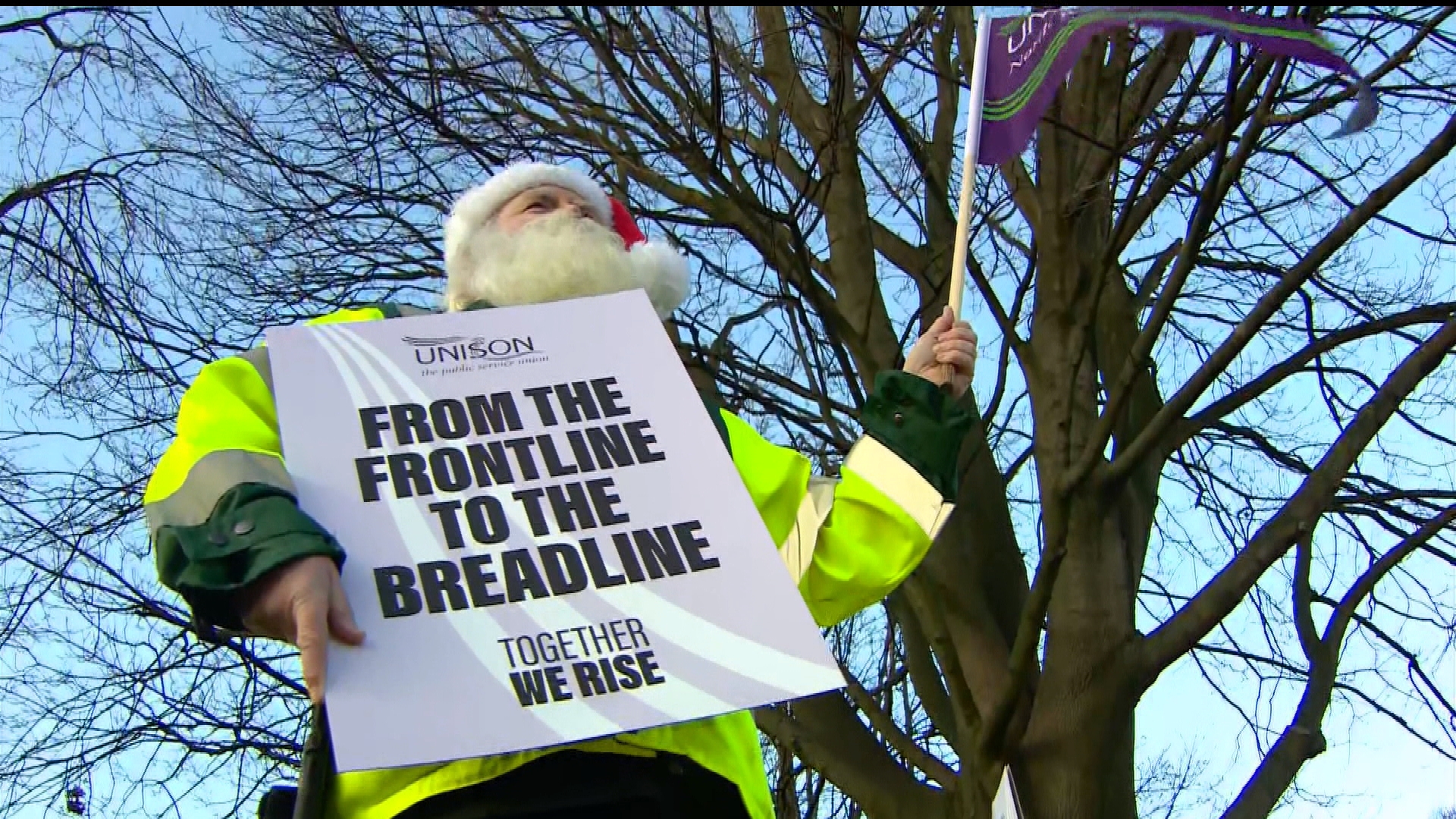 A striking ambulance worker dressed as Father Christmas joined picket ...