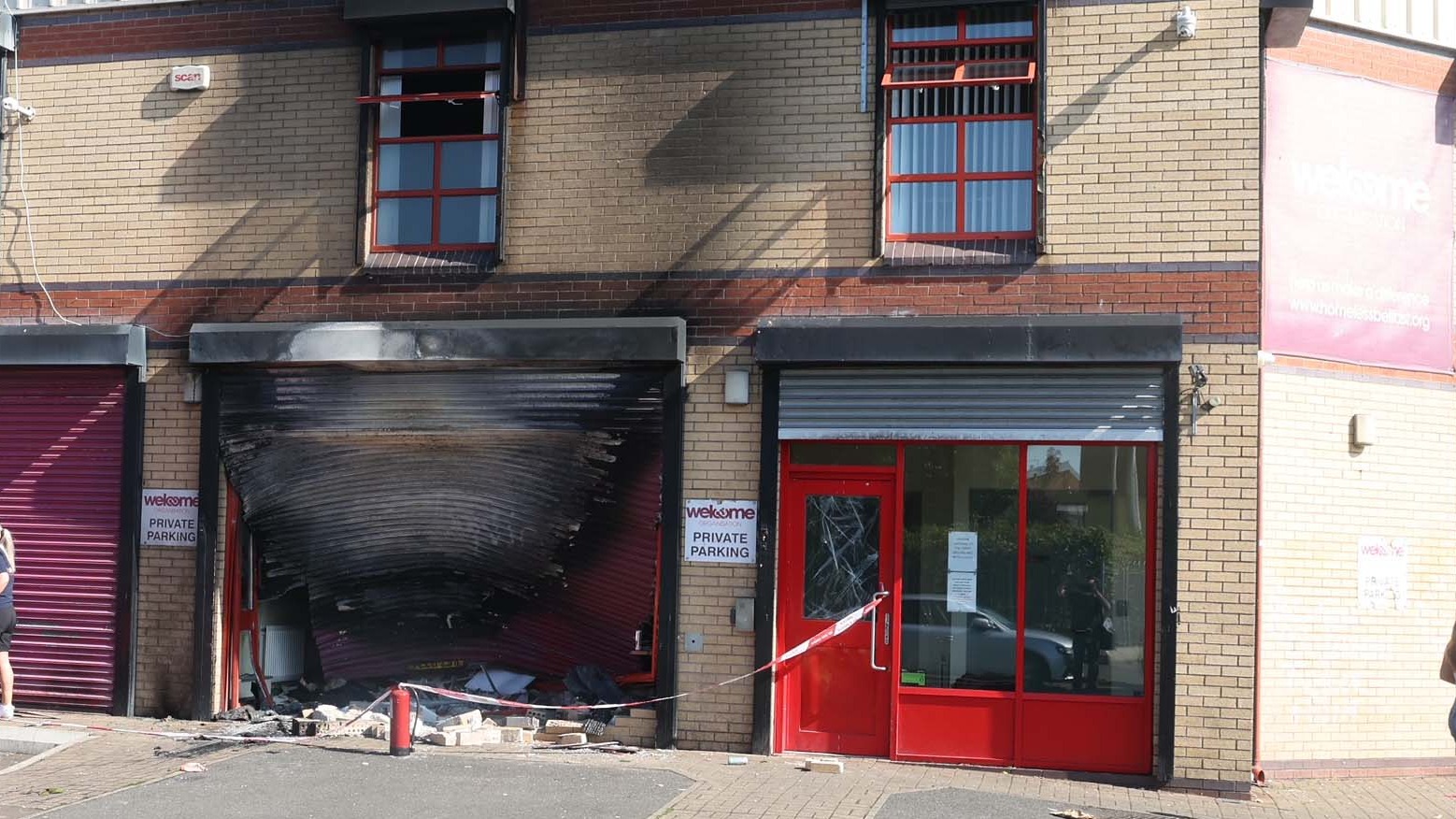 Car rammed into charity building and set alight in Belfast | UTV | ITV News
