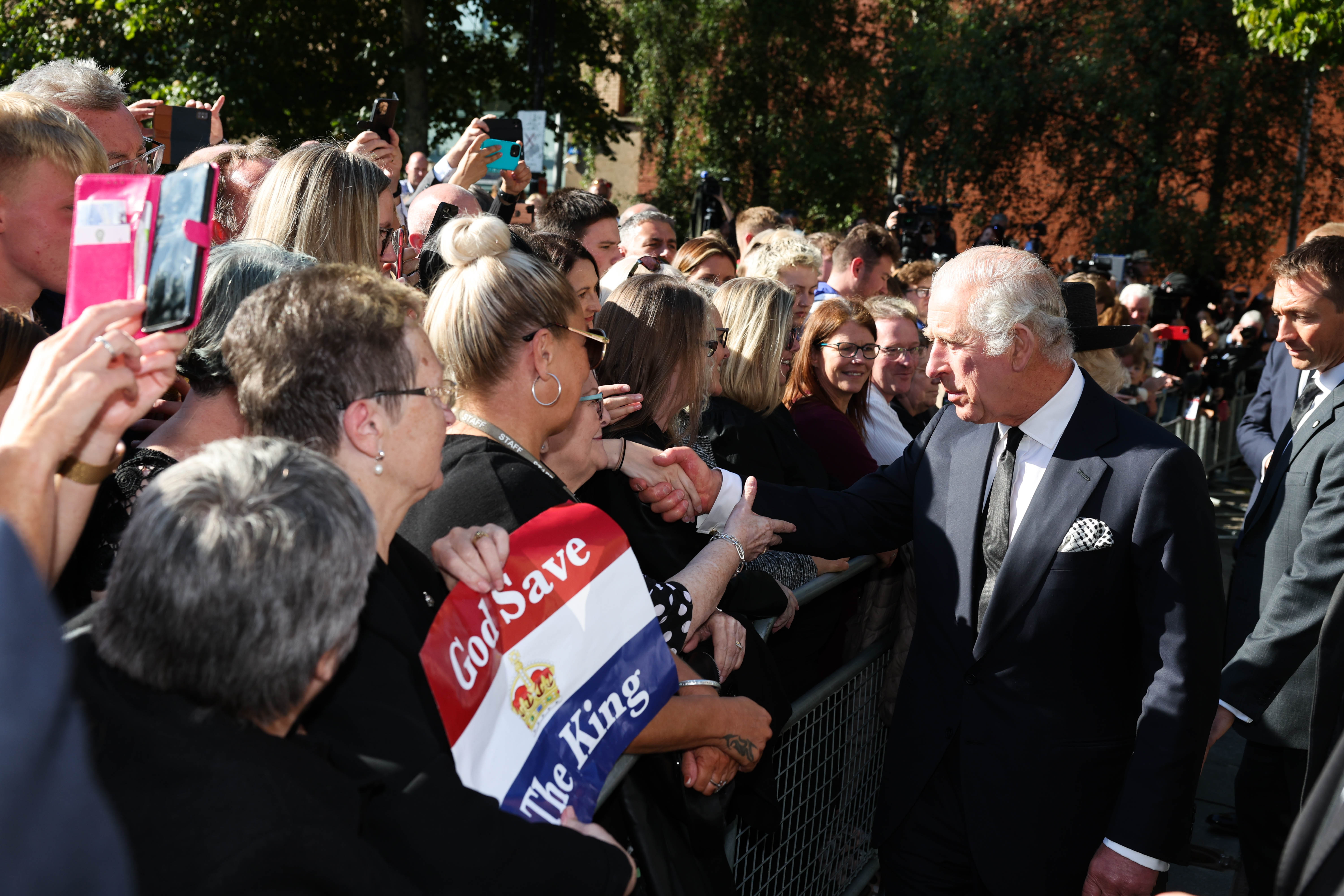 Thousands turn out to welcome King Charles III and Queen Consort for ...