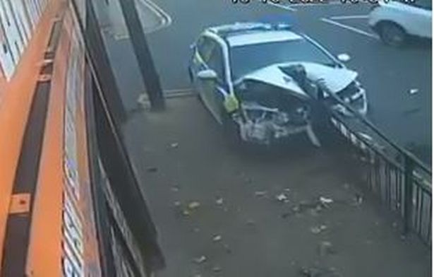 CCTV captures moment police car crashes into metal barrier in Oldham ...