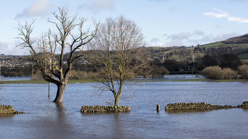 Flood barriers erected as river levels rise after heavy rains | ITV News