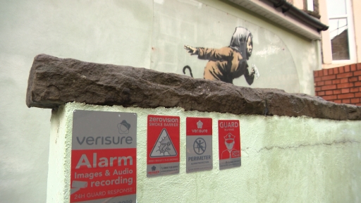 Owners of Banksy property step up security to protect 'achoo' artwork ...