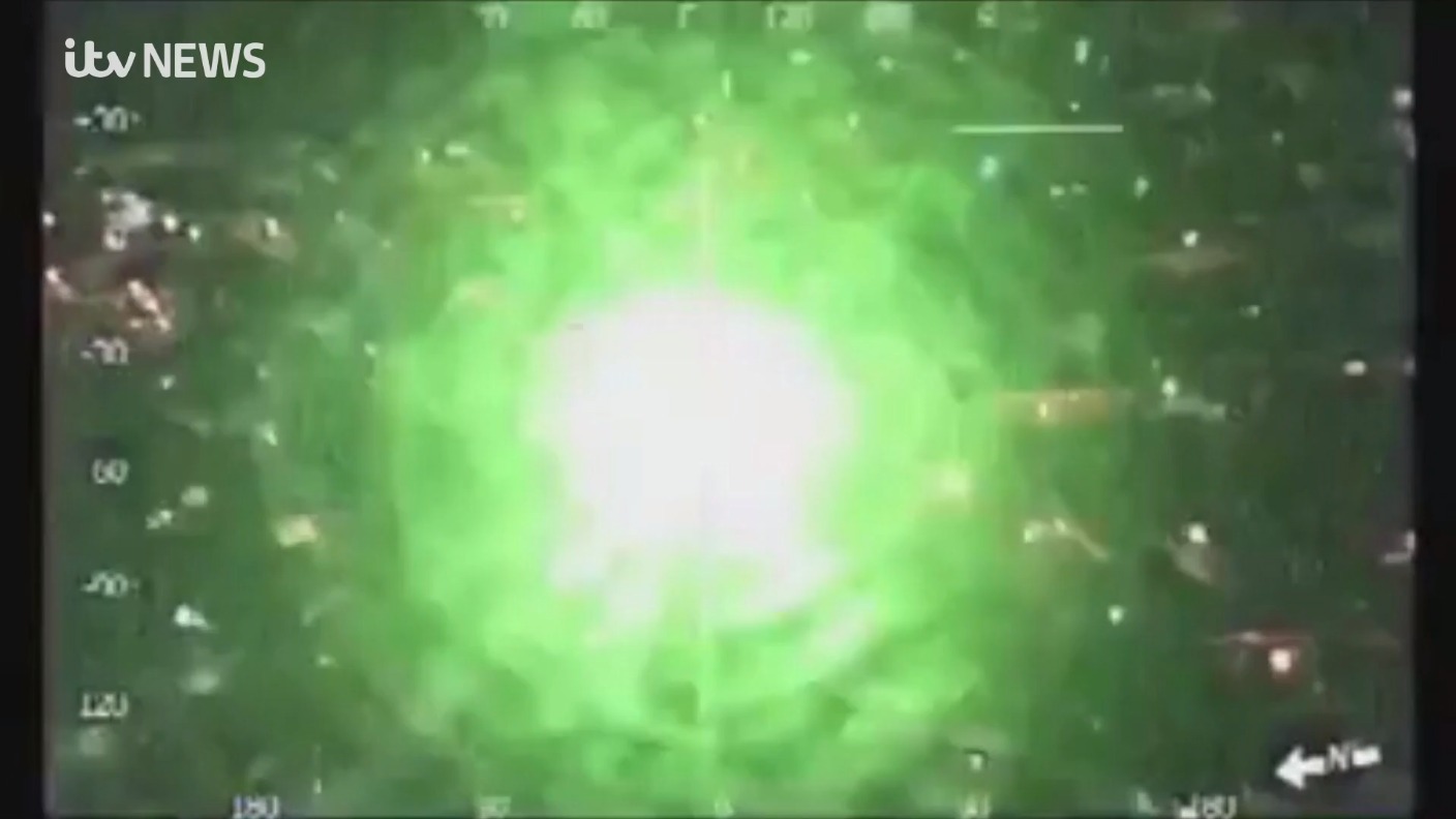 Shocking footage shows man shining laser at police helicopter | ITV ...