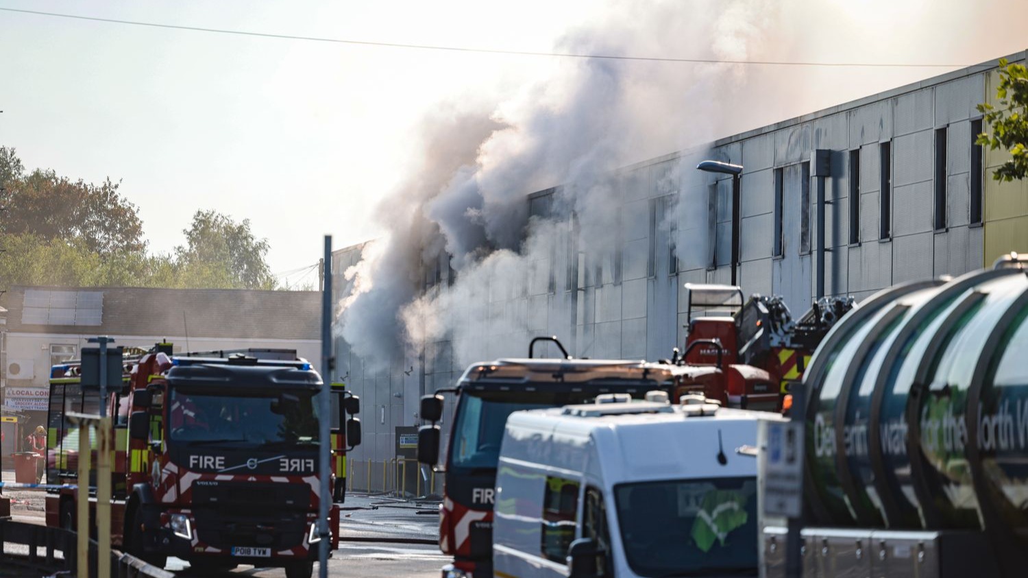 Dozens of firefighters still tackling large fire at storage unit in ...