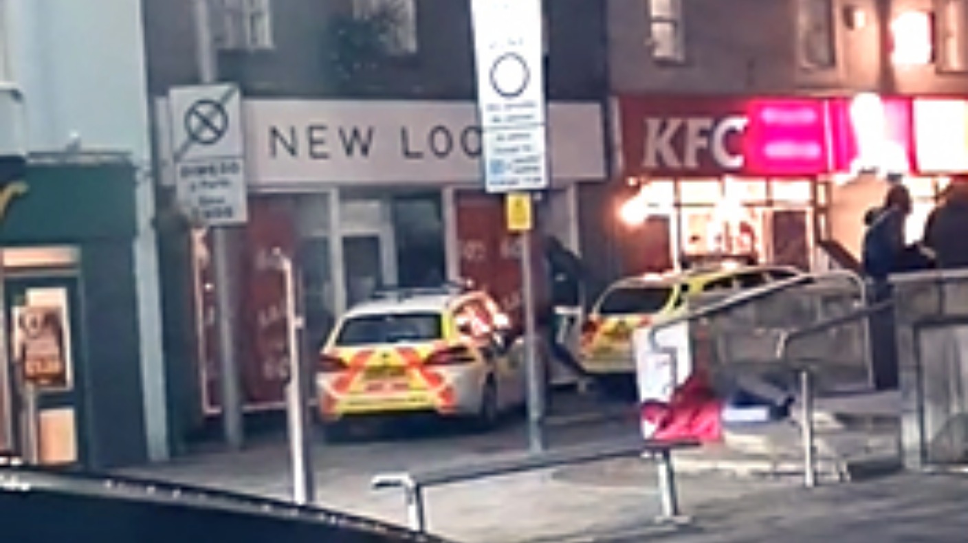 Teenagers caught on camera kicking a police car | ITV News Wales