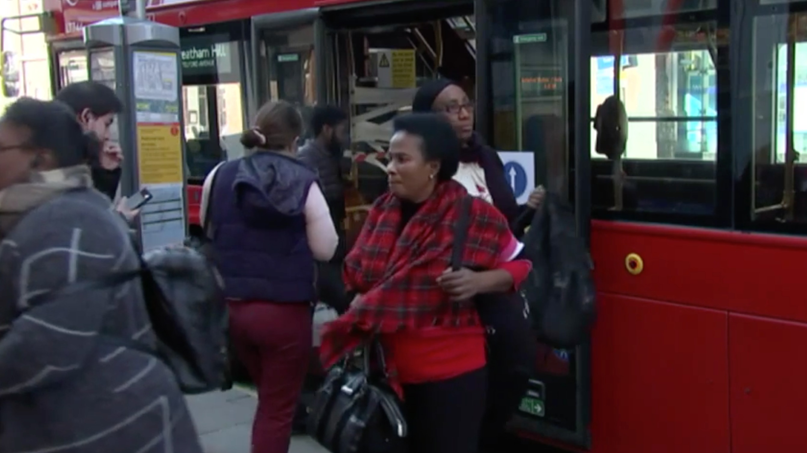Bus passengers struggle to stay safe distance apart under new boarding ...