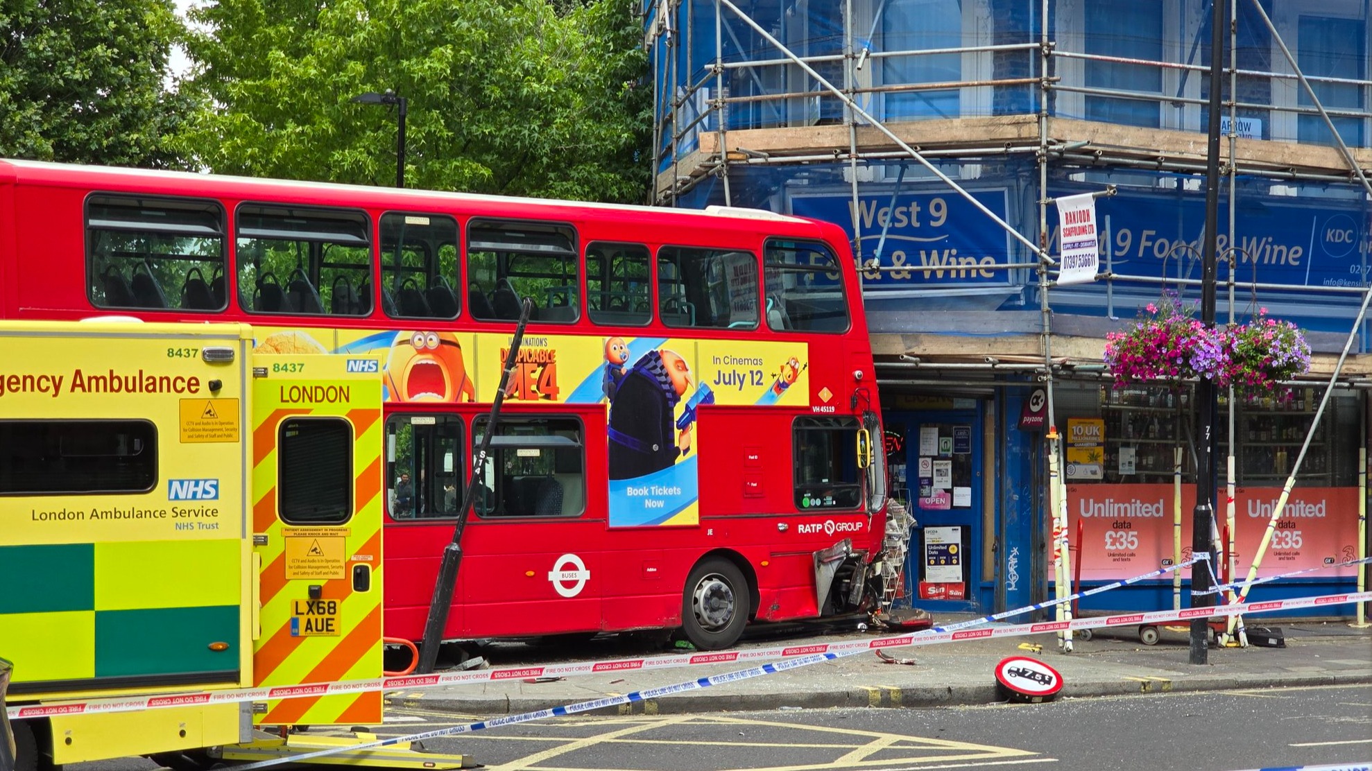 Seven injured as bus smashes into food and wine shop in West London ...