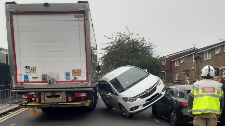 Mind the gap! Driver ends up wedged between lorry and car in Plumstead ...