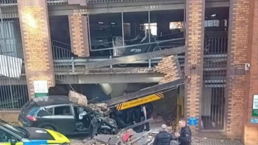 Two pedestrians seriously injured and man arrested after car park crash ...