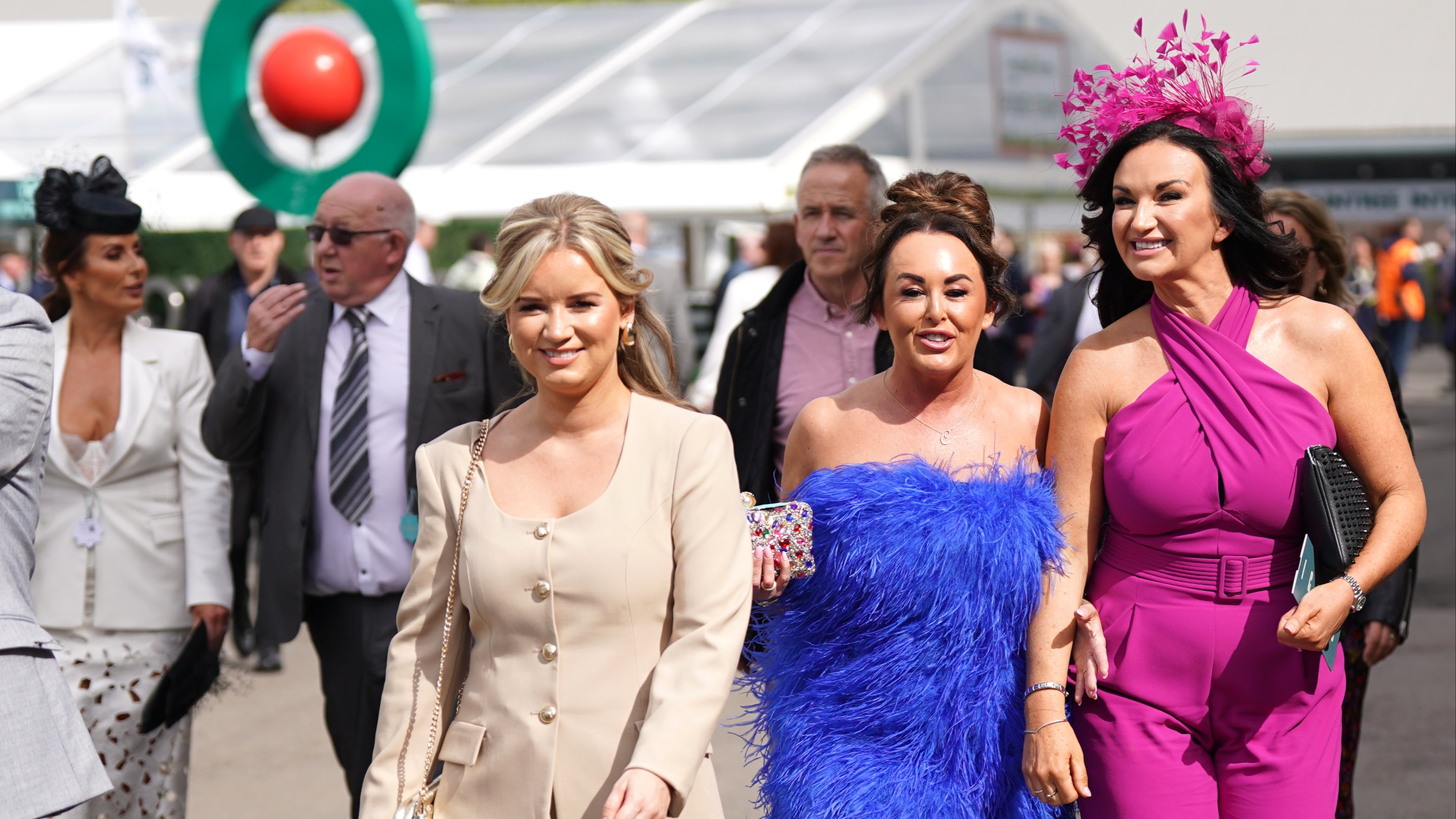 Racegoers arrive at Aintree for the first day of the Grand National ...