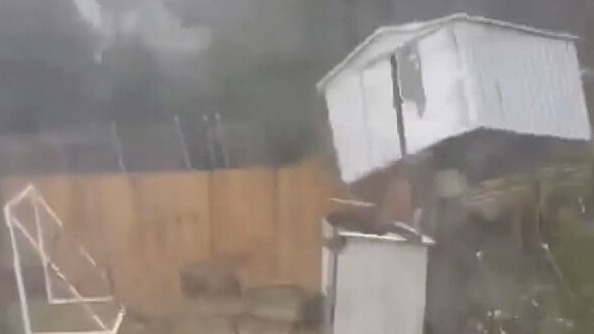 Car windows smashed and trees torn down as suspected tornado rips ...