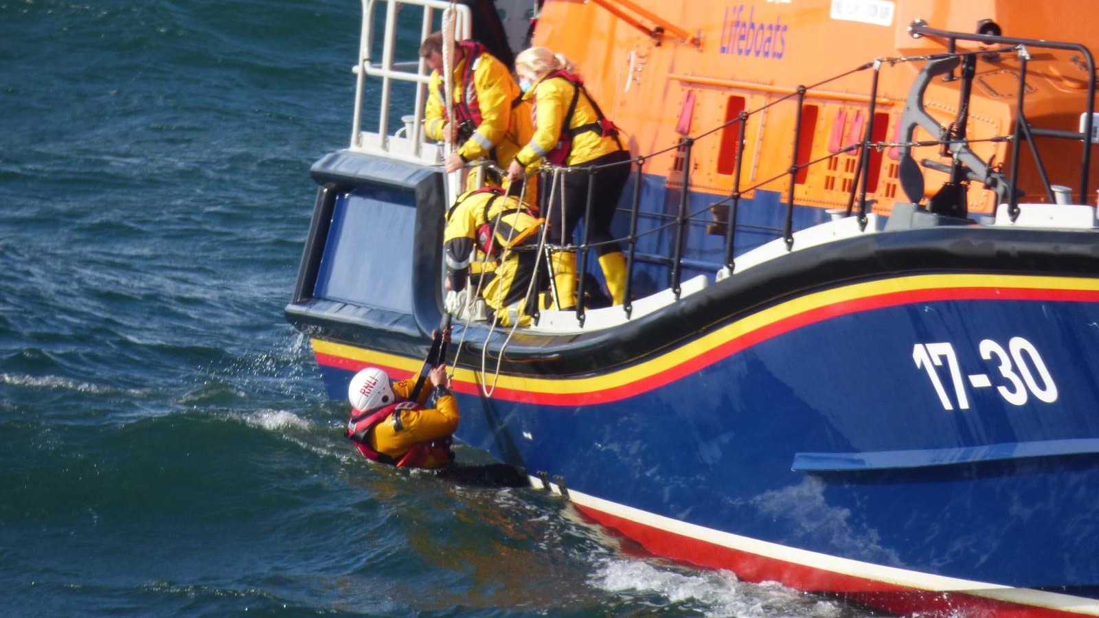 The moment a teenage boy was saved by lifeboat crews despite ...