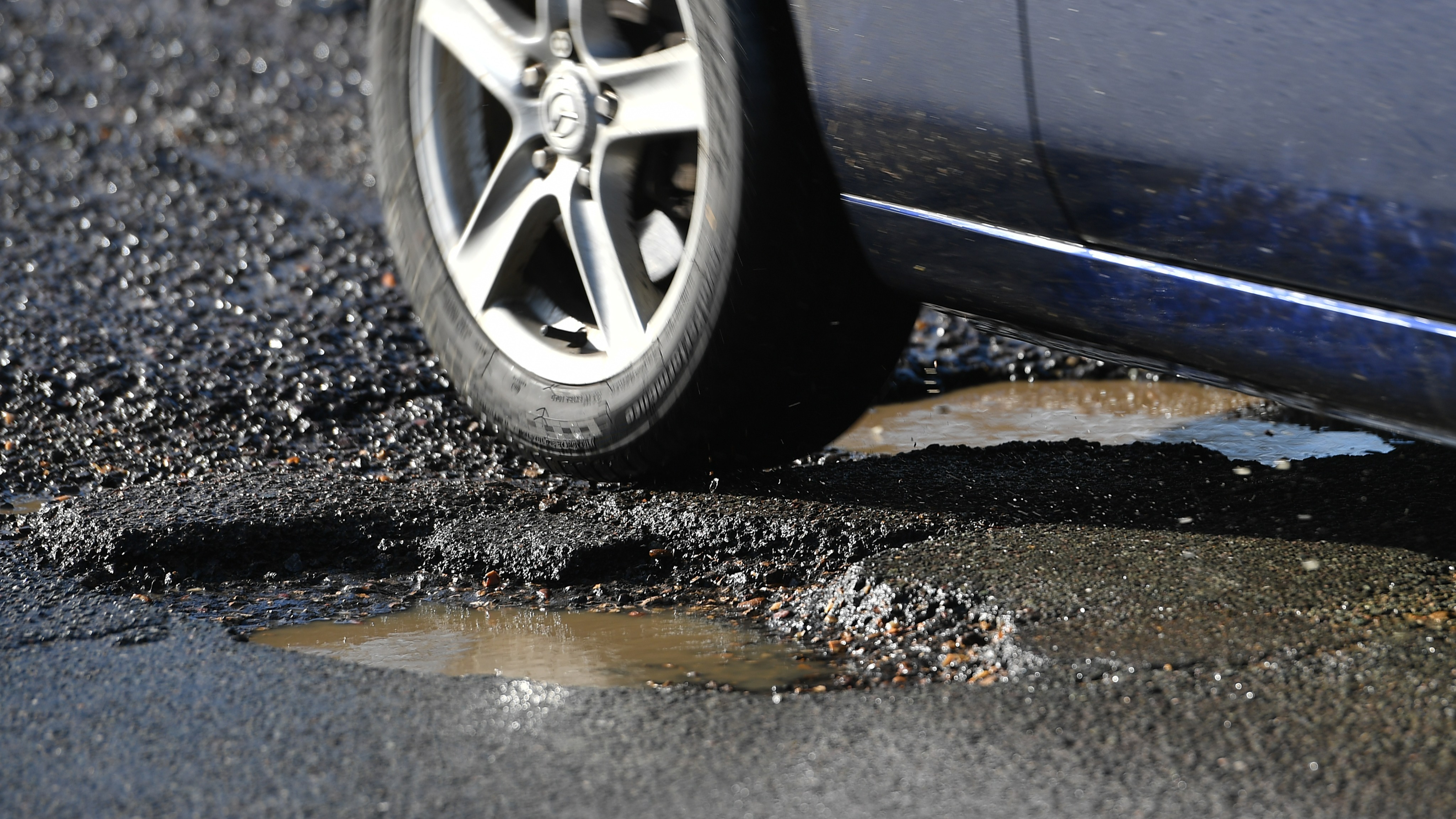 Pothole problems: Record £16bn repair bill as roads reach 'breaking ...