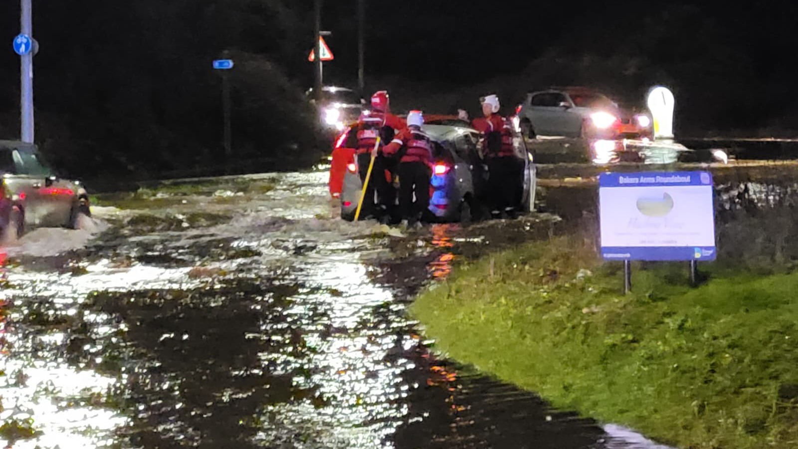 Firefighters rescue more than 20 people from flooding as warnings ...