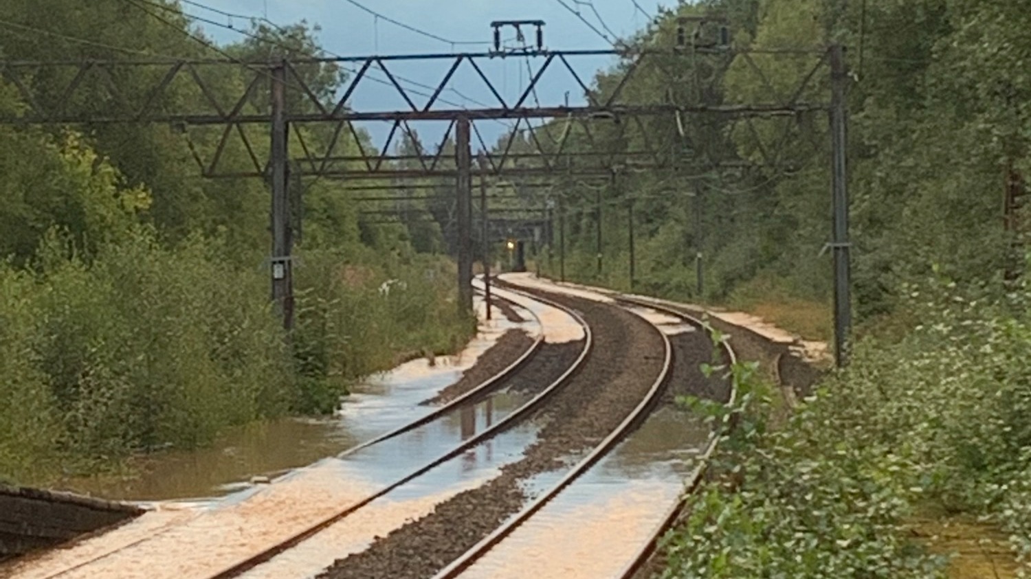 Flooded railway tracks cause 'severe delays' at Audenshaw in Manchester ...