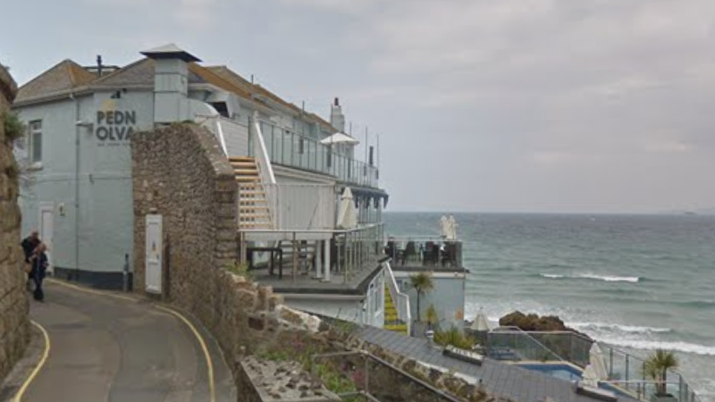 Man in his 50s dies after falling from building onto St Ives beach ...