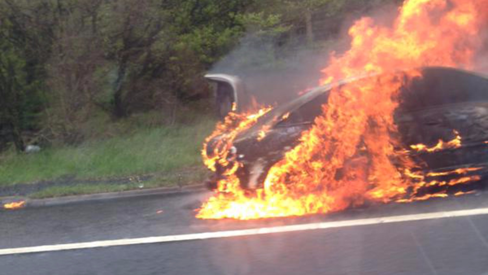 Three people escape serious injury as car bursts into flames on ...