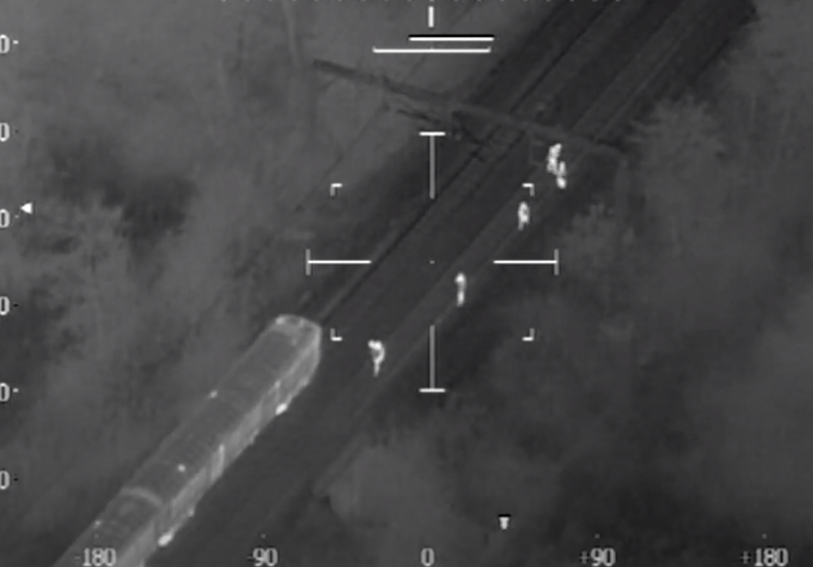 Police footage of after partygoers flee 'rave' on live train tracks ...