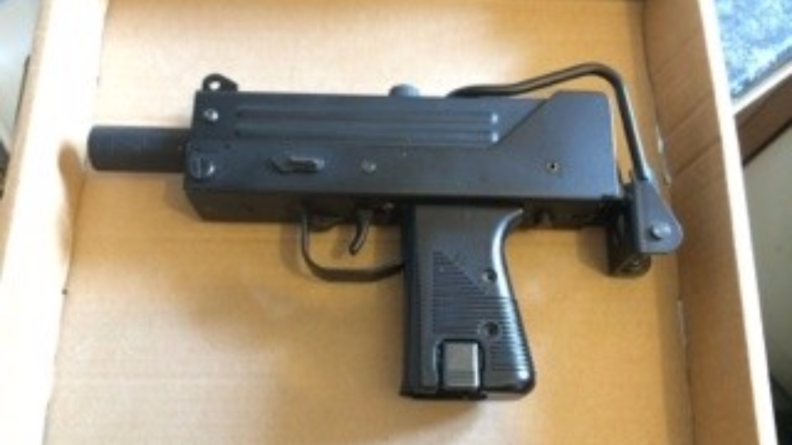 Two men jailed after semi-automatic submachine gun found in kitchen ...
