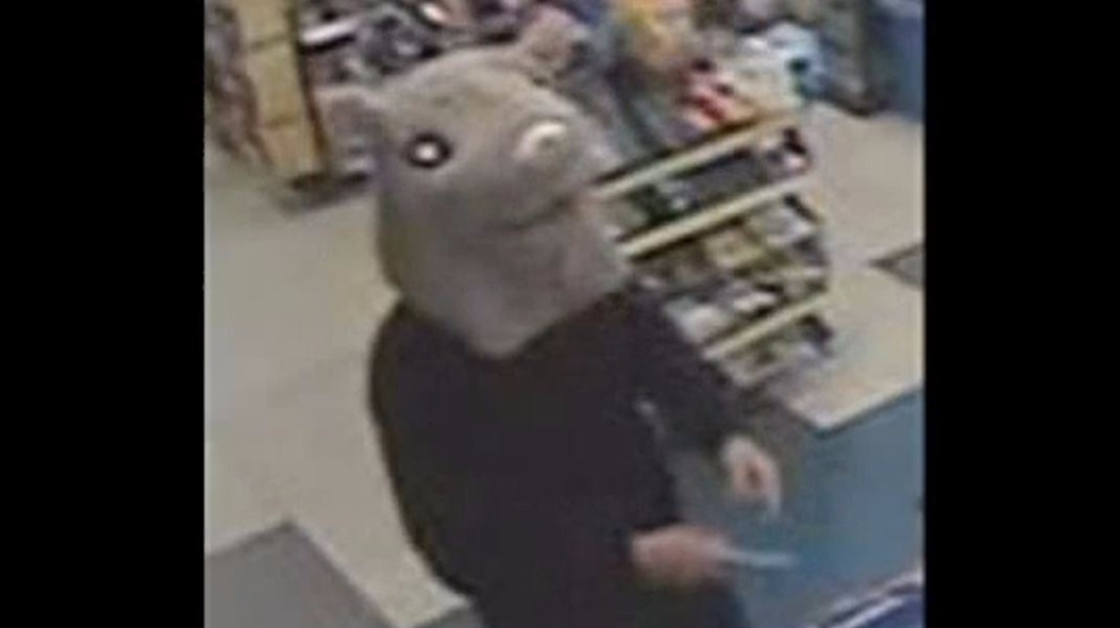 CCTV shows Canadian armed robber hold up a shop in a mouse mask | ITV News