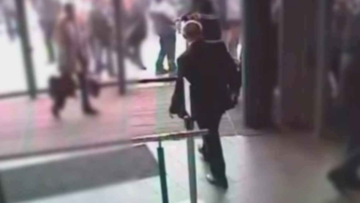 CCTV shows the moment a security guard is knocked out as cabbie protest ...