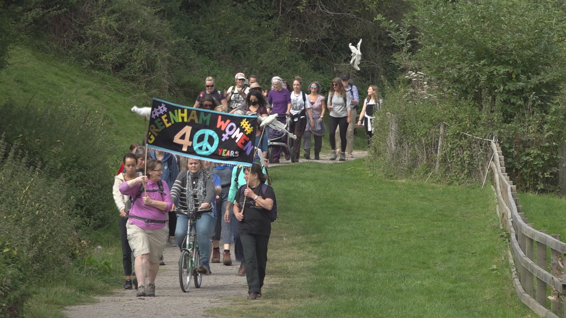 Women march on the 40th anniversary of the first Greenham Common ...