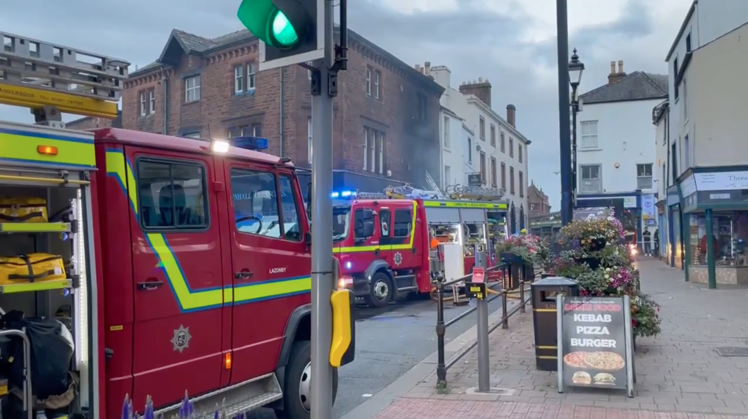 Emergency services deal with fire in Penrith town centre | ITV News Border