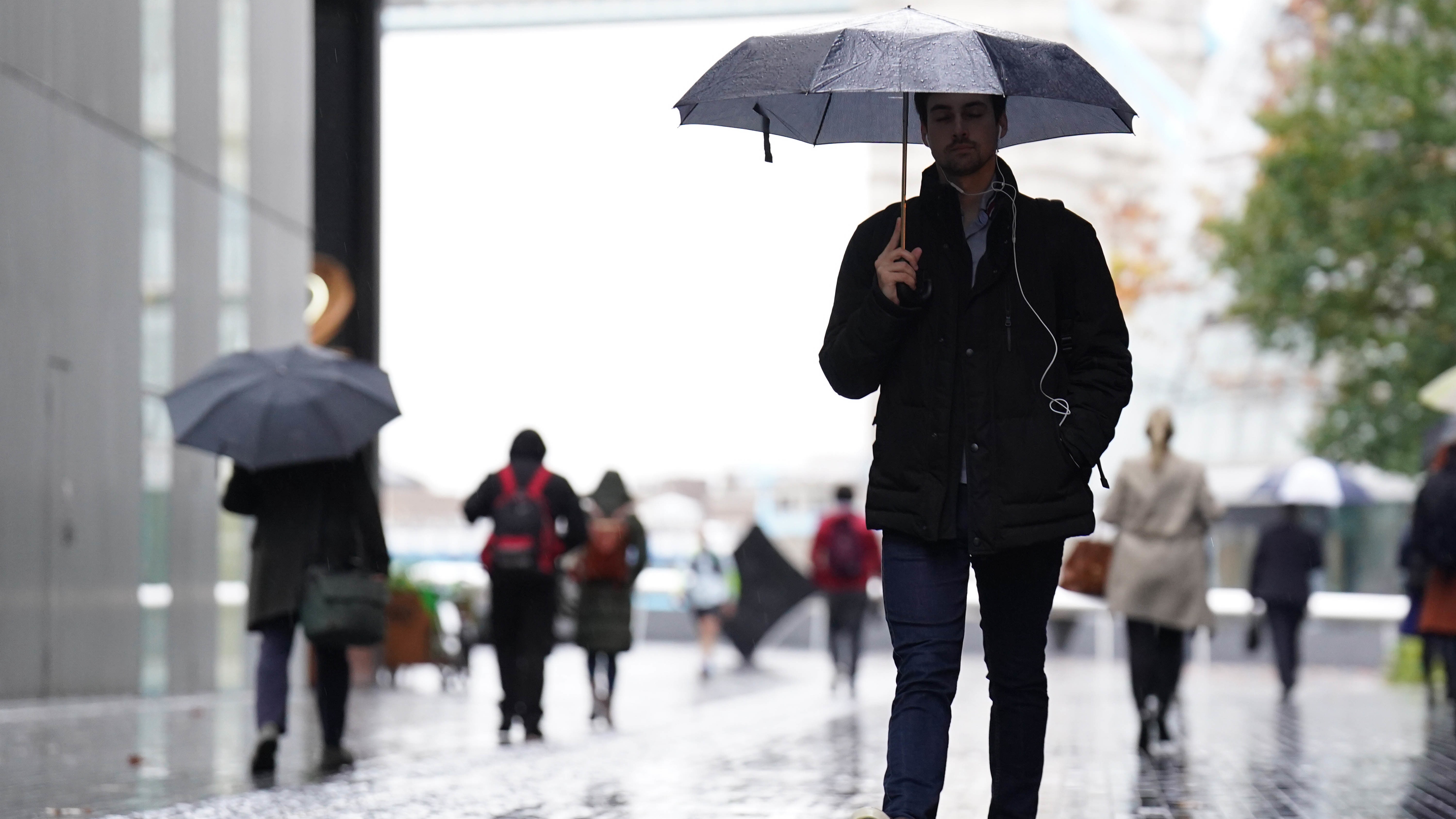 Britons warned of 'miserable conditions' as rain warnings issued across ...