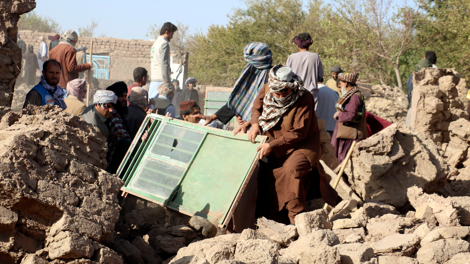 Afghans dig out the dead with bare hands as thousands killed in ...