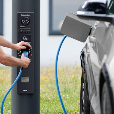 Bollard tubes with integrated loading unit · BEGA