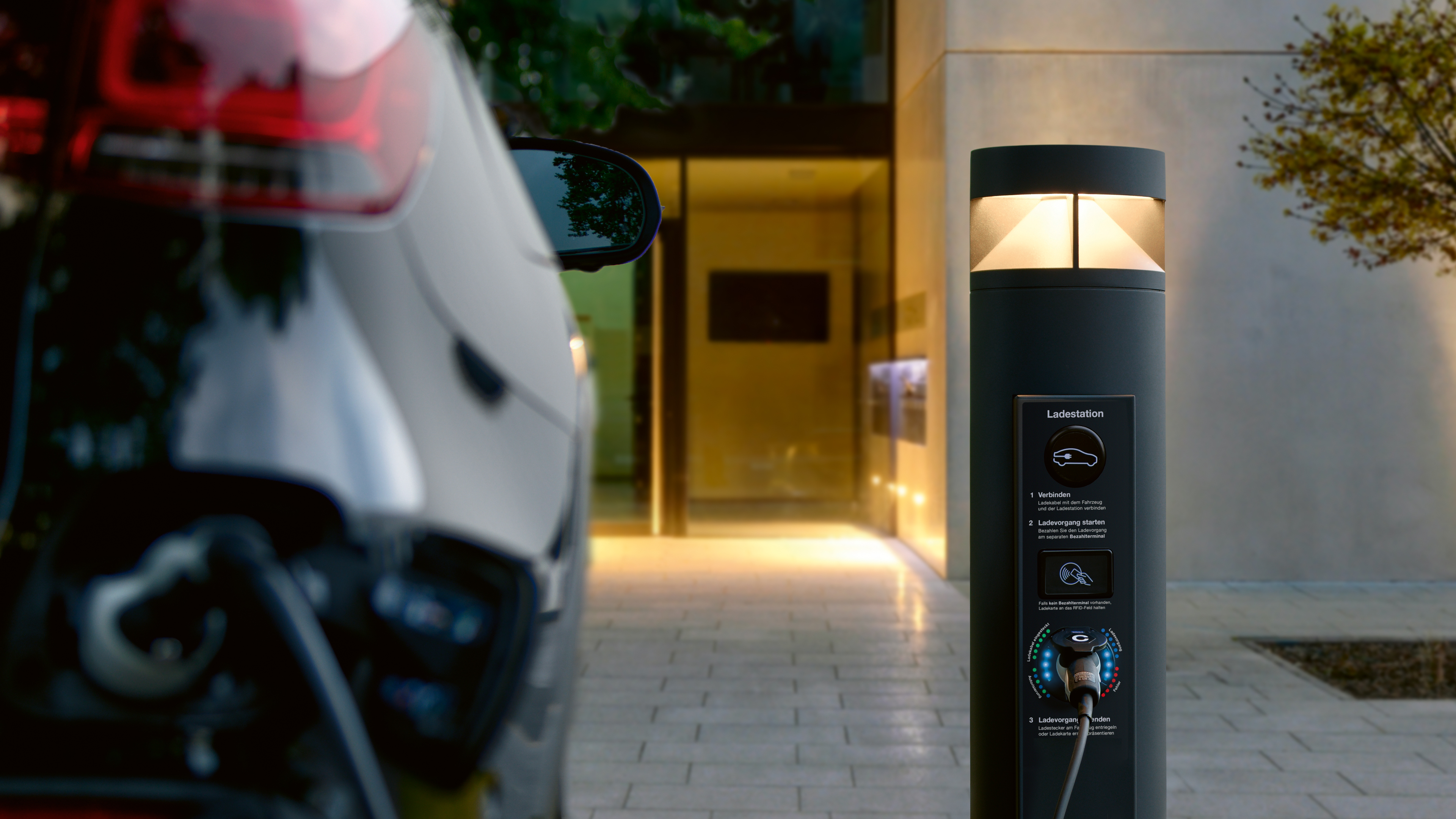 Bollard tubes with integrated loading unit · BEGA