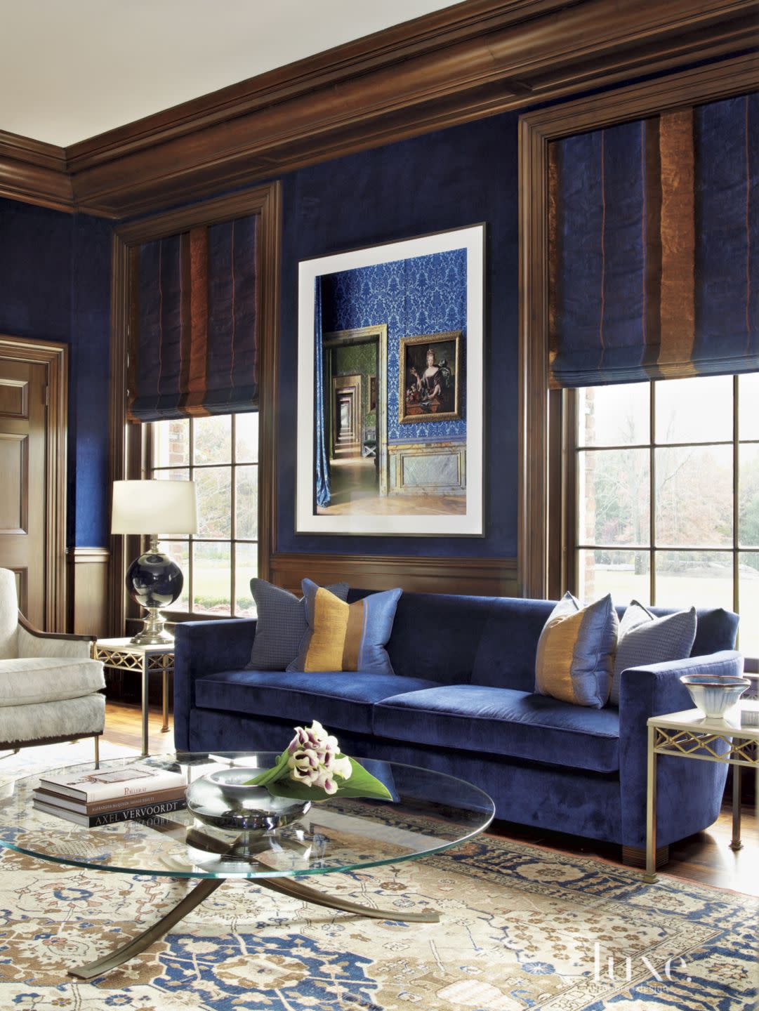 Traditional Blue Library with French Windows | Luxe Interiors + Design