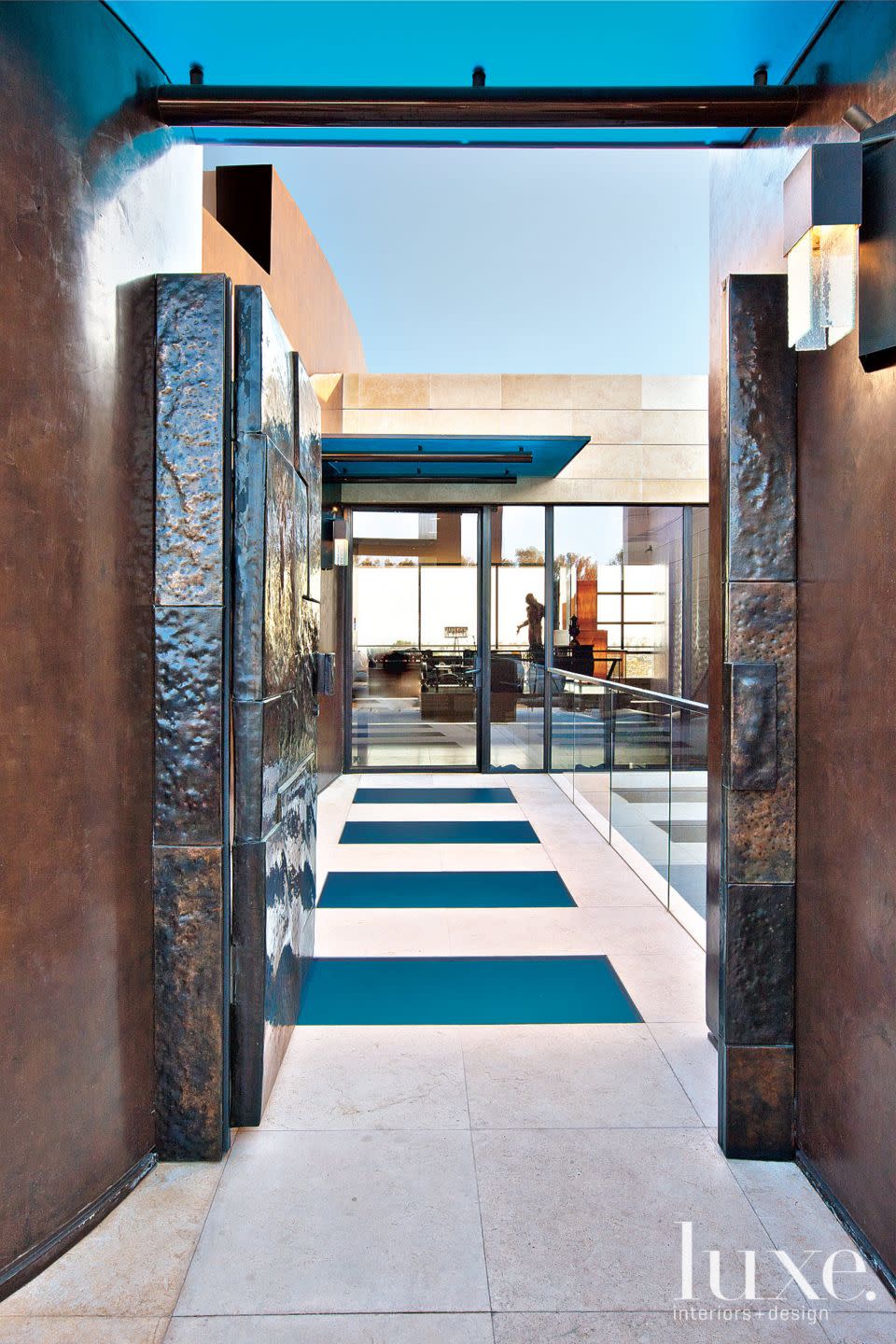 Modern Neutral Entry Bridge with Blue Glass Marquees | LUXE Interiors ...