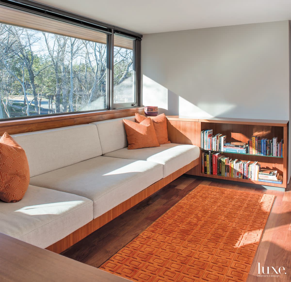 Modern Neutral Reading Area with Built-In Sofa | LUXE Interiors + Design