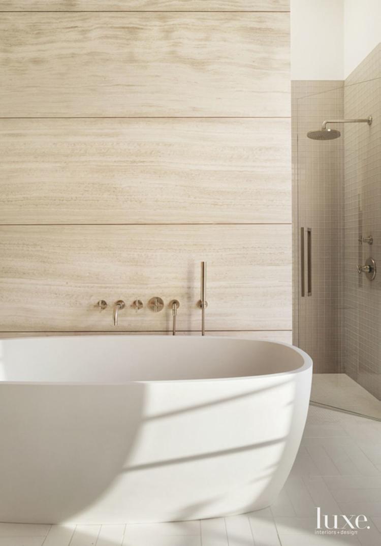 Modern Limestone Master Bath with Soaking Tub | LUXE Interiors + Design