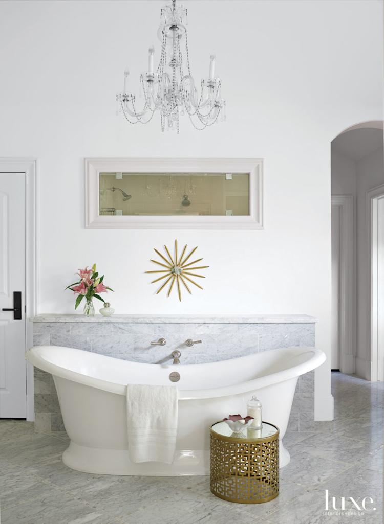 Transitional White Bathroom with Gold Side Table | Luxe Interiors + Design
