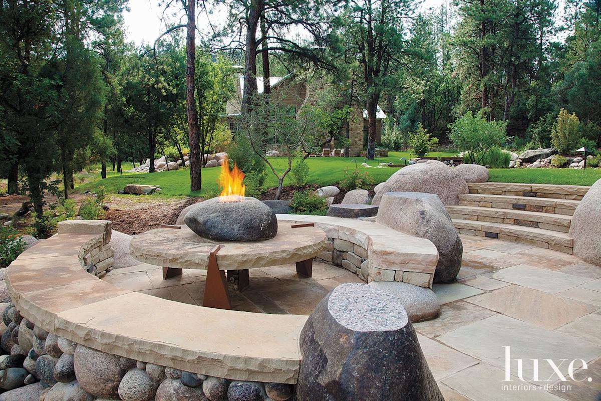 Country Neutral Outdoor Seating Area with Stone Firepit | Luxe ...